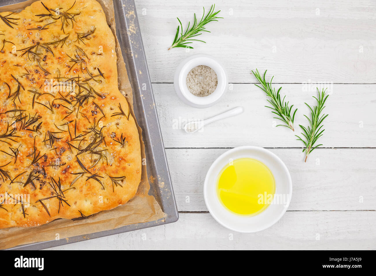 Focaccia on baking tray Stock Photo - Alamy