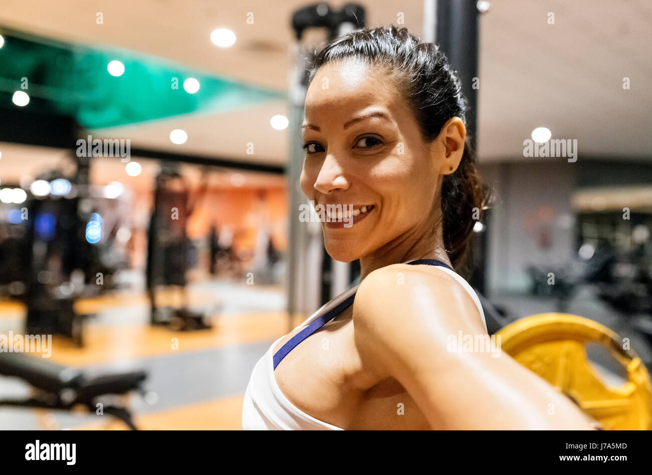 Smiling woman after work out in the gym Stock Photo - Alamy