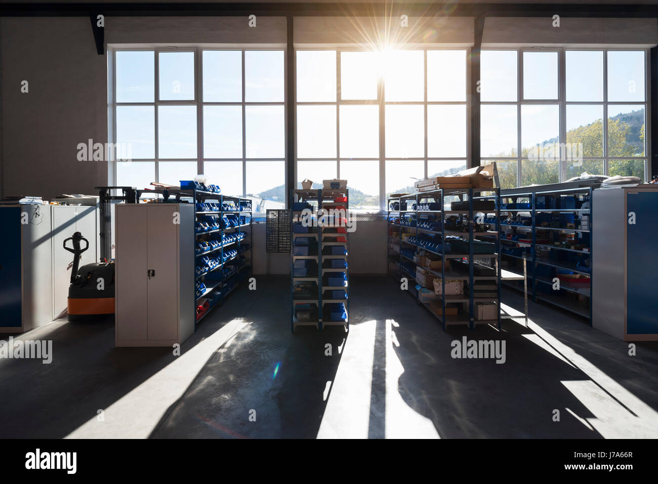 Factory shop floor in backlight Stock Photo - Alamy