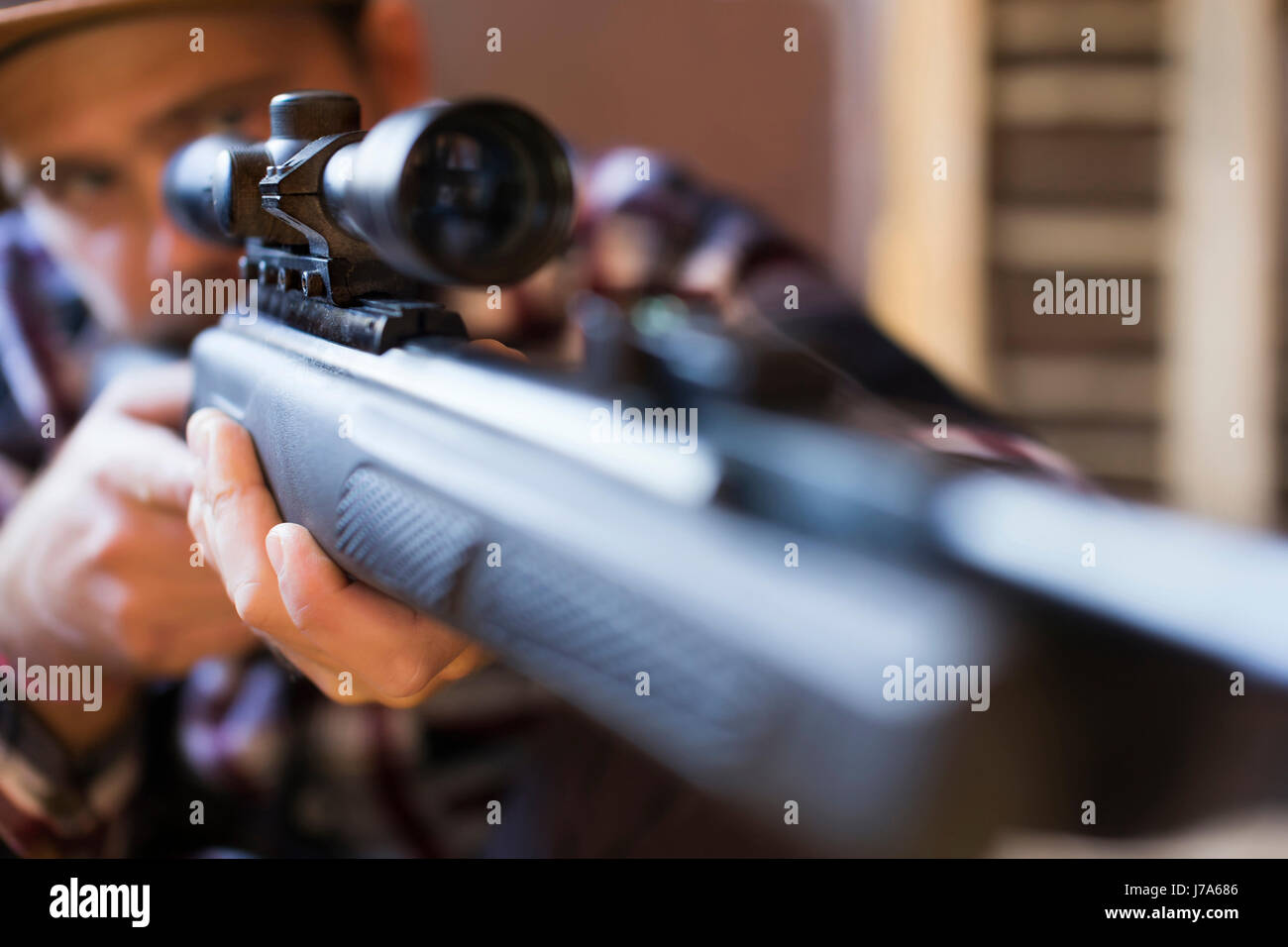 Man aiming with rifle Stock Photo - Alamy