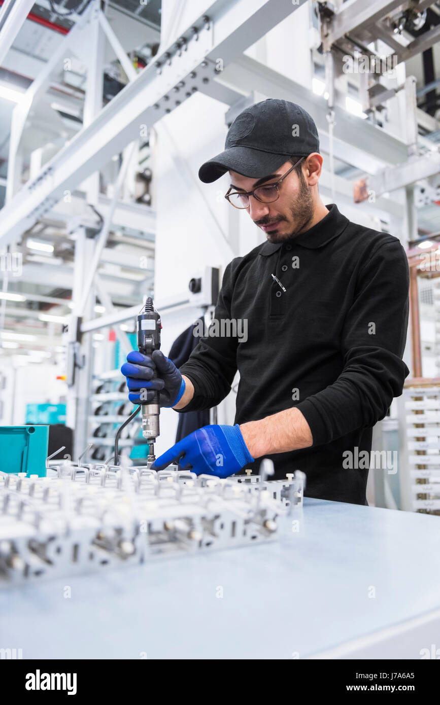 Man working in factory shop floor Stock Photo - Alamy