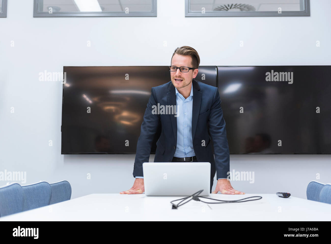 Manager giving a presentation in a conference room Stock Photo - Alamy