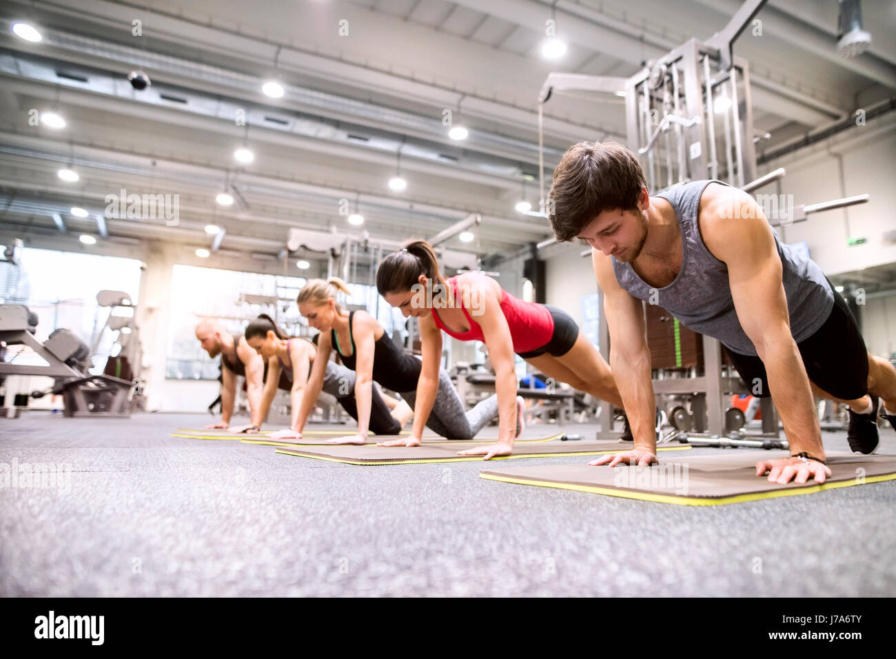 Group of athletes exercising in gym Stock Photo - Alamy