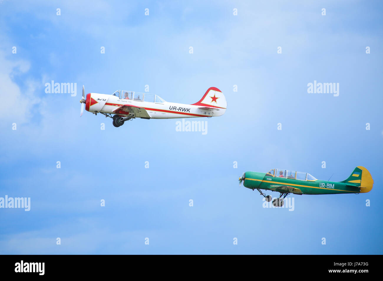two Yak-52 aerobatic planes fly in formation during the Kev aviation ...
