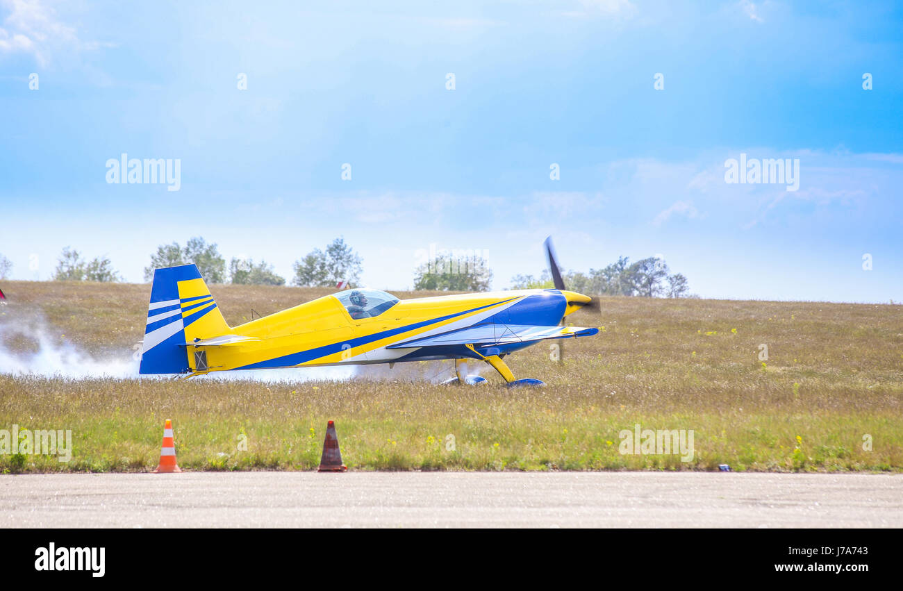 A small sport plane have just landed on a grass airfield Stock Photo ...