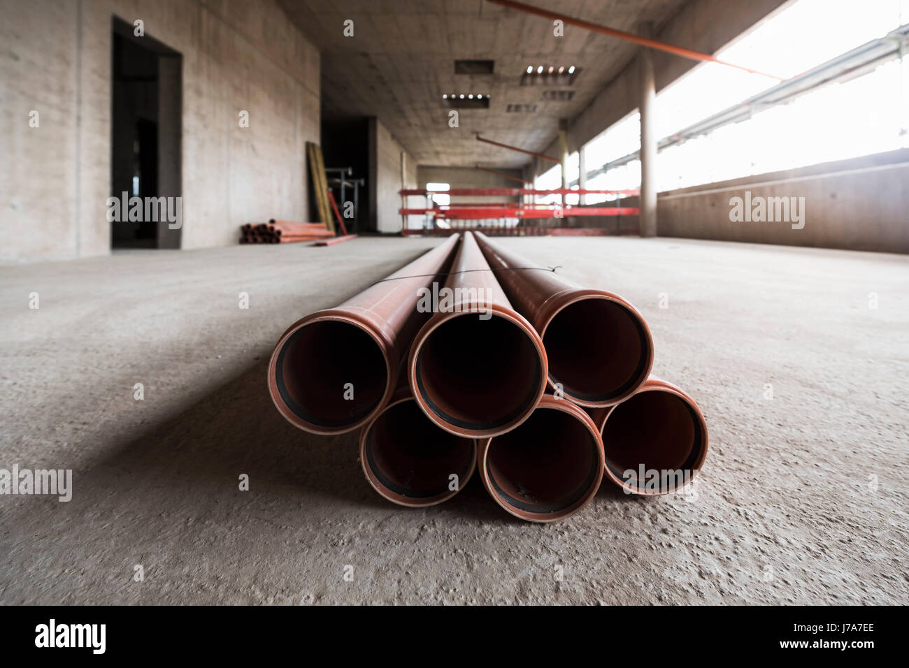 Pipes in an unfinished building under construction Stock Photo - Alamy