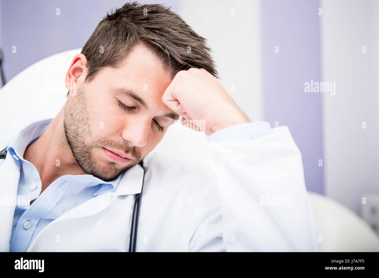 Portrait of exhausted doctor Stock Photo - Alamy