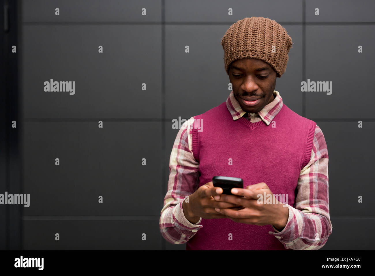 Portrait of man looking at cell phone Stock Photo - Alamy