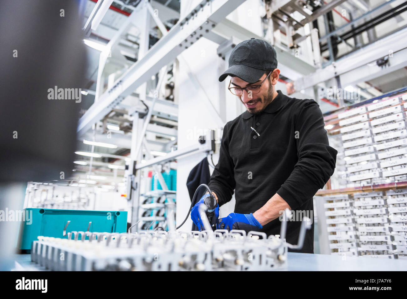 Man working in factory shop floor Stock Photo - Alamy