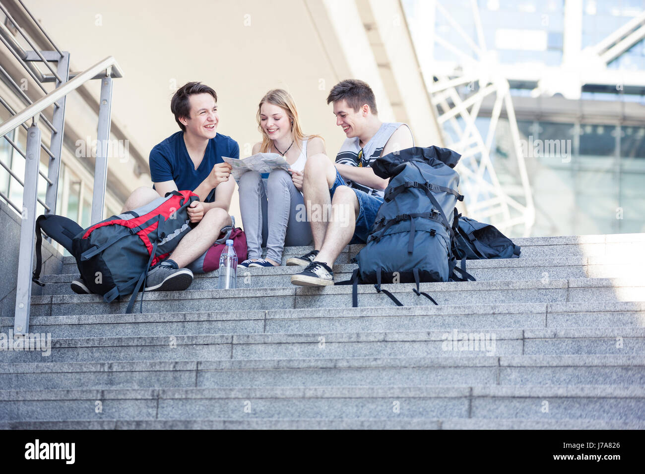 Young people exploring Berlin, looking at map Stock Photo - Alamy
