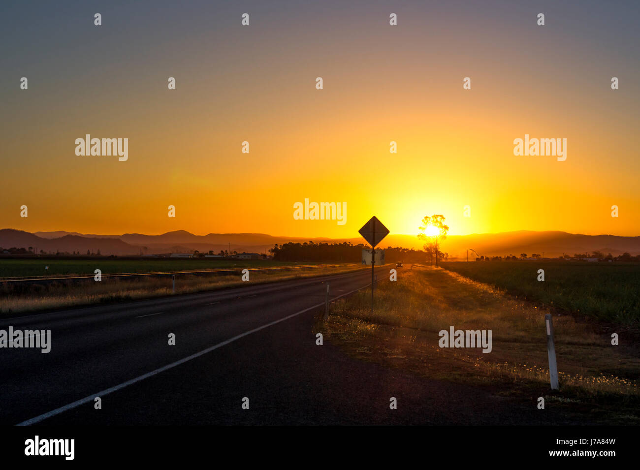 Australia, Queensland, landscape near Mackay, road at sunset Stock ...