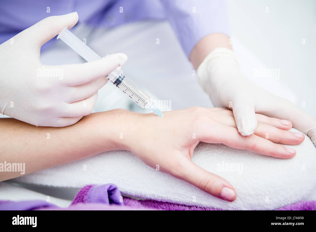 Aesthetic surgery, woman receiving injection Stock Photo - Alamy