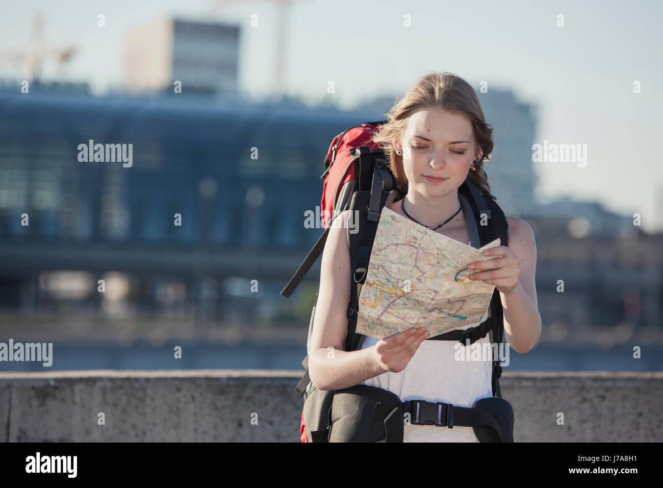 Young woman backpack map berlin hi-res stock photography and images - Alamy