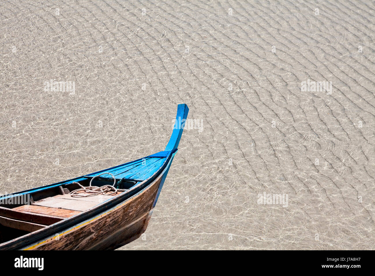 Boats on the beach.Transparent sea water background. We can see ...