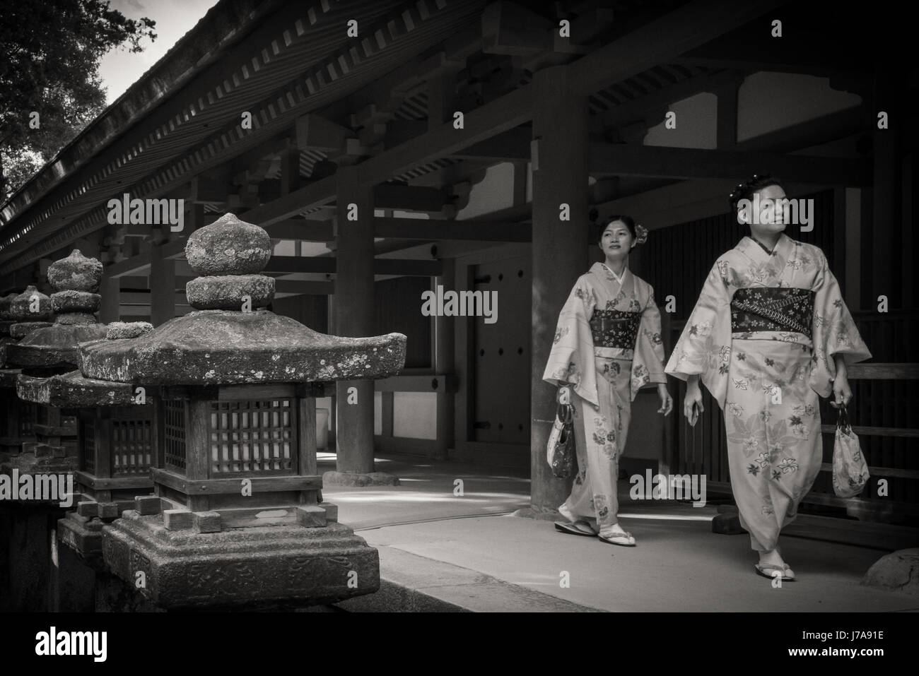 Black and white photo of two young women wearing their furisode in Nara ...