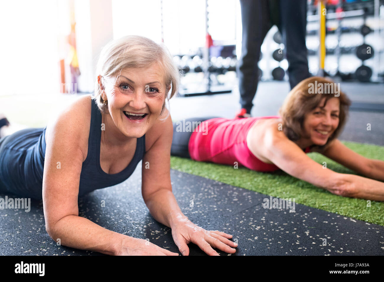 Two fit senior women having fun in gym Stock Photo - Alamy