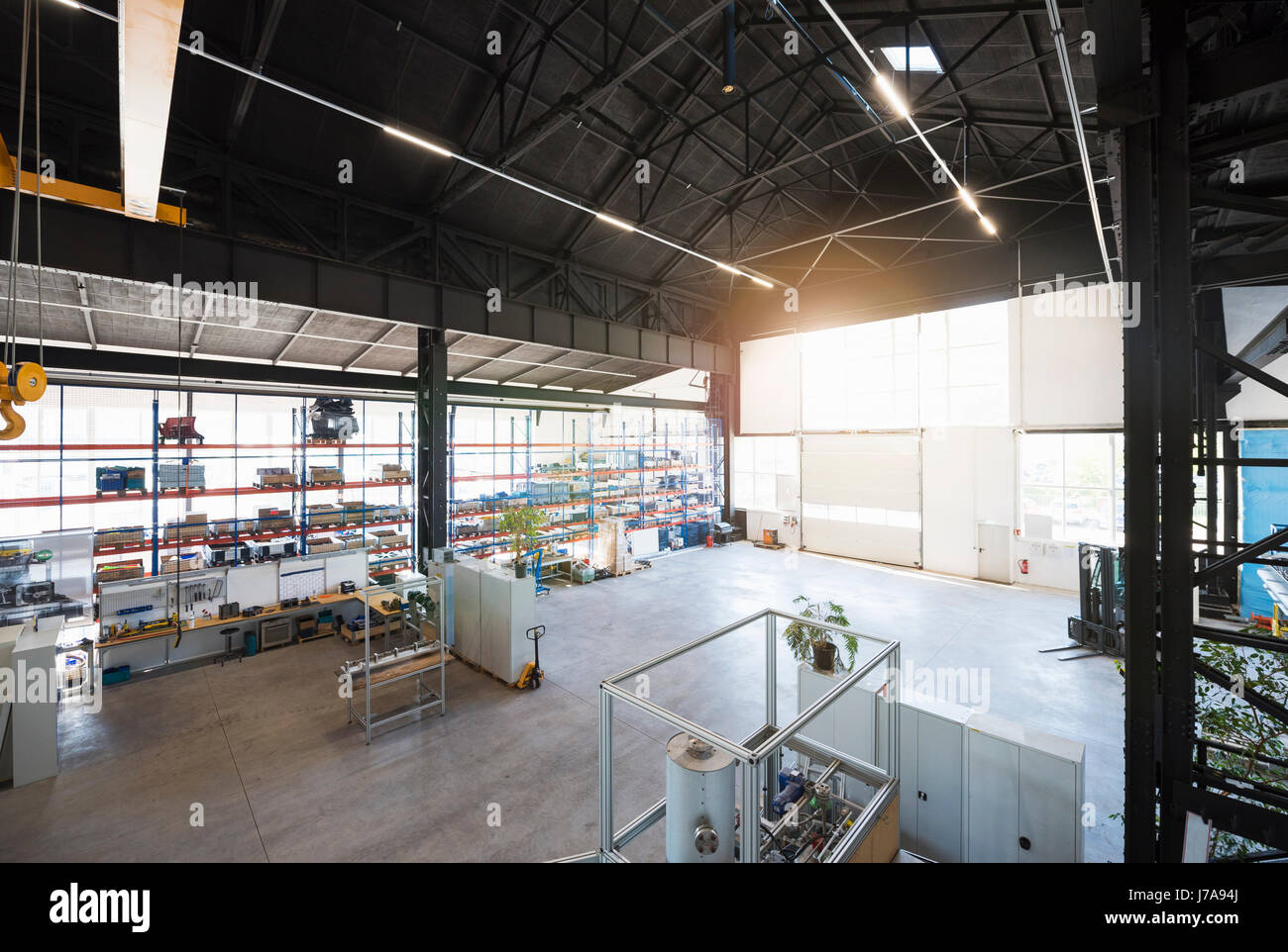 Factory shop floor in backlight Stock Photo - Alamy