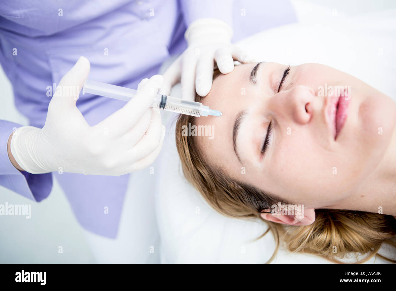 Aesthetic surgery, woman receiving injection Stock Photo - Alamy