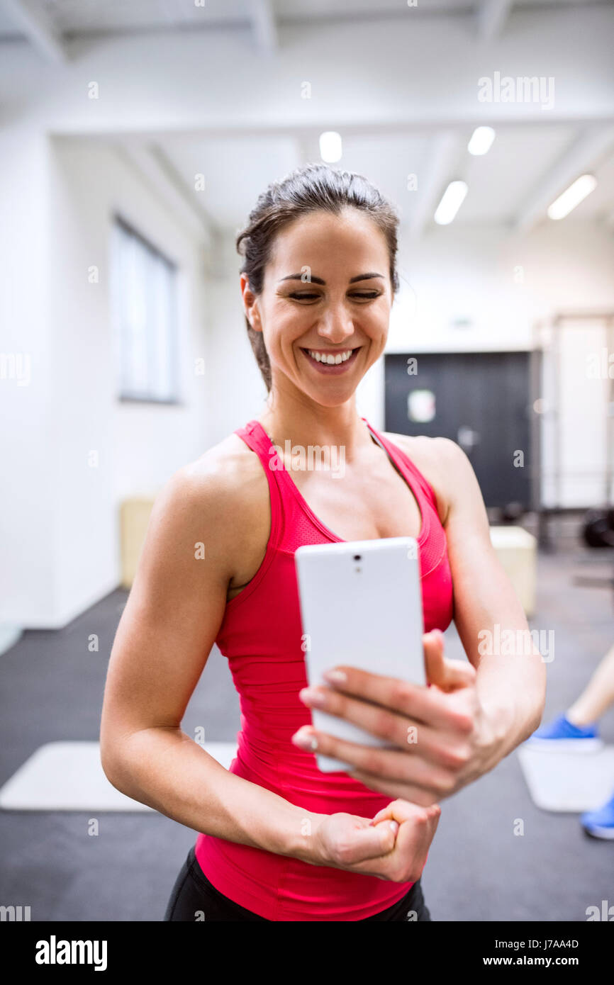 Young female athete taking selfies in gym Stock Photo - Alamy