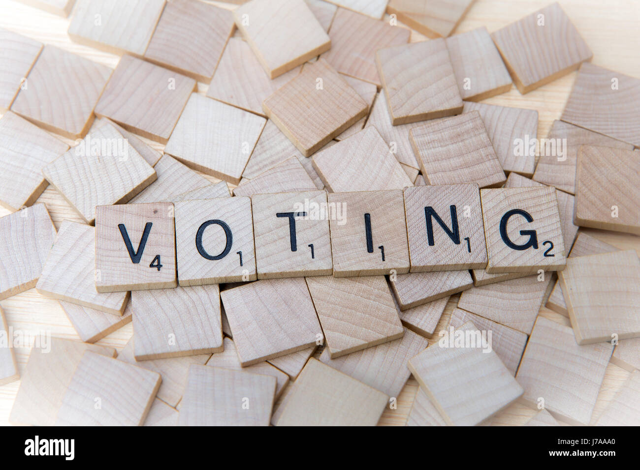 Voting spelt with scrabble letters on wood tiles Stock Photo - Alamy