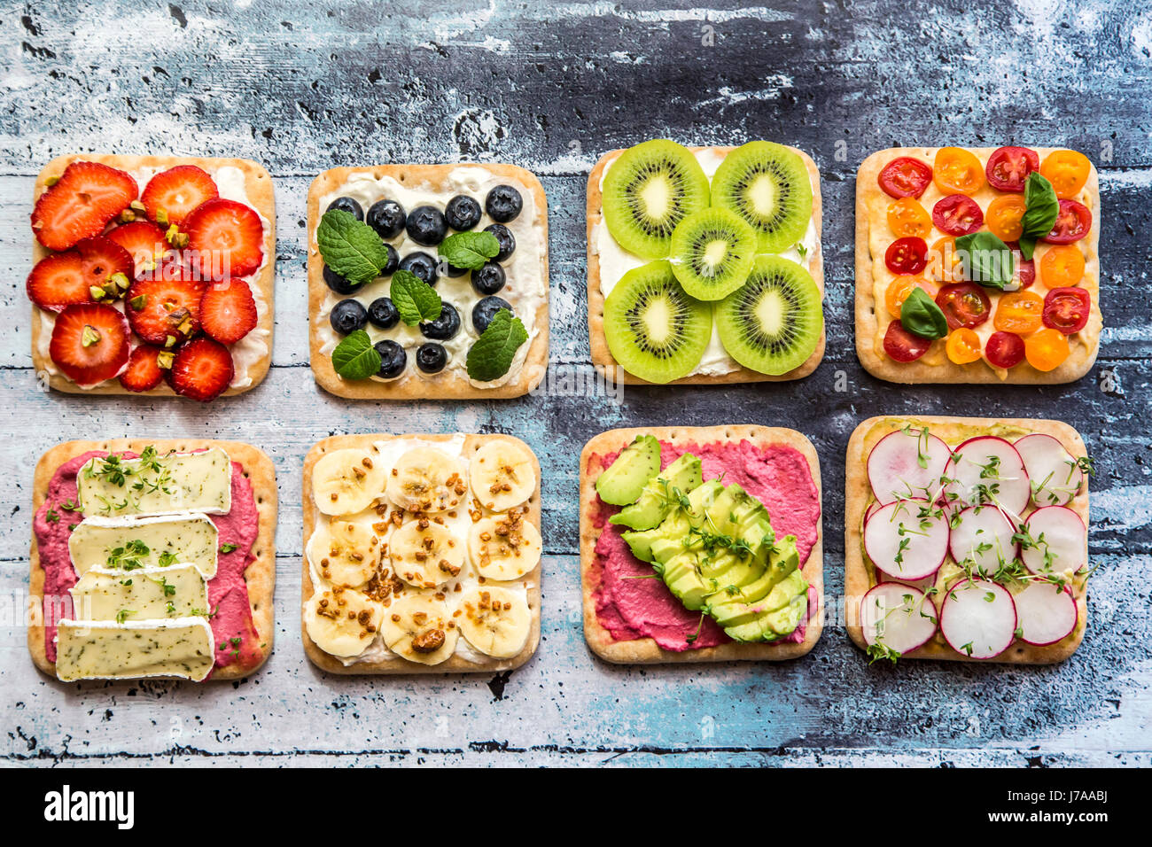 Two rows of various garnished sandwiches Stock Photo - Alamy