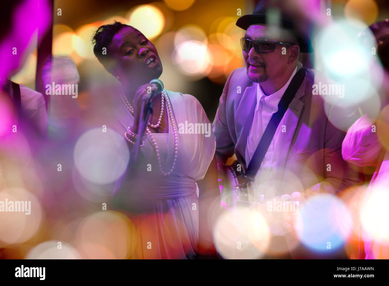 Band playing with woman singing Stock Photo - Alamy