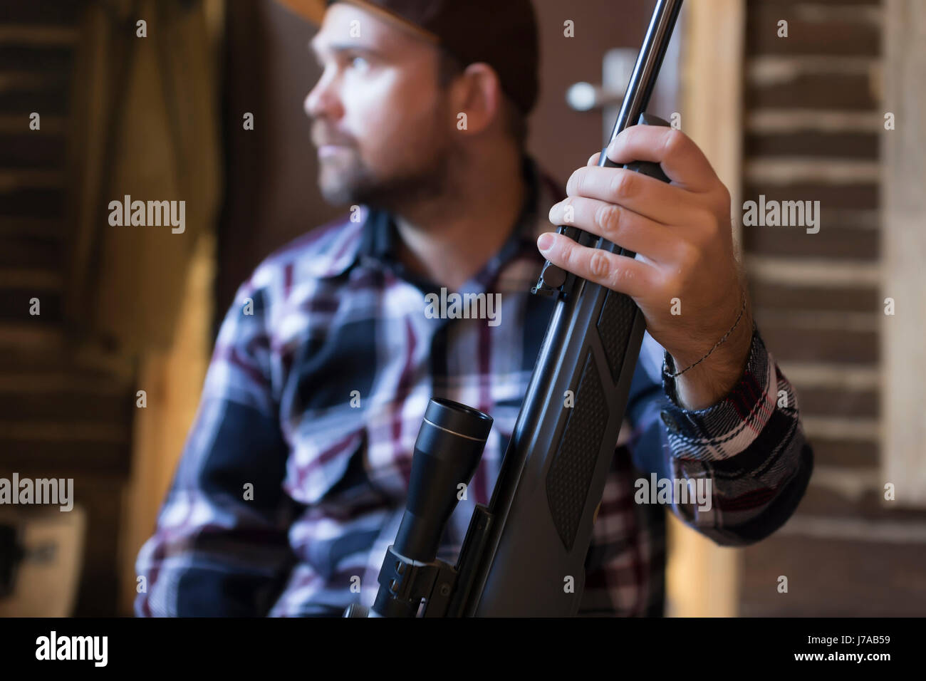 Man with rifle Stock Photo - Alamy