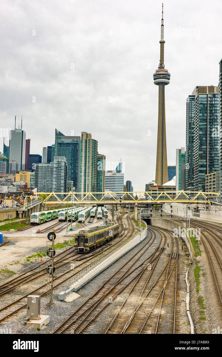 Train Tracks And Trains In Foreground With CN Tower In Background ...