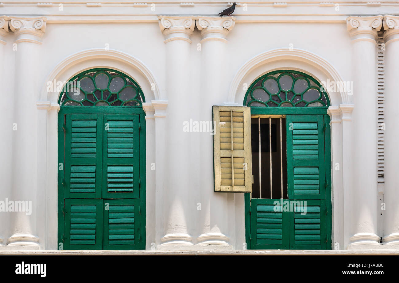 Colonial vintage building exterior with wooden windows for background ...