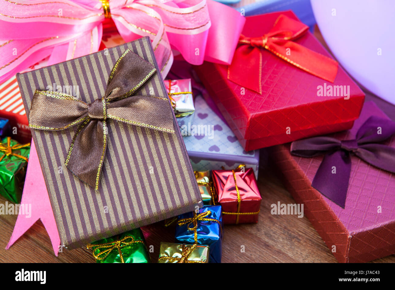 stack of gift box lying on top wood table use for gift festival of new ...