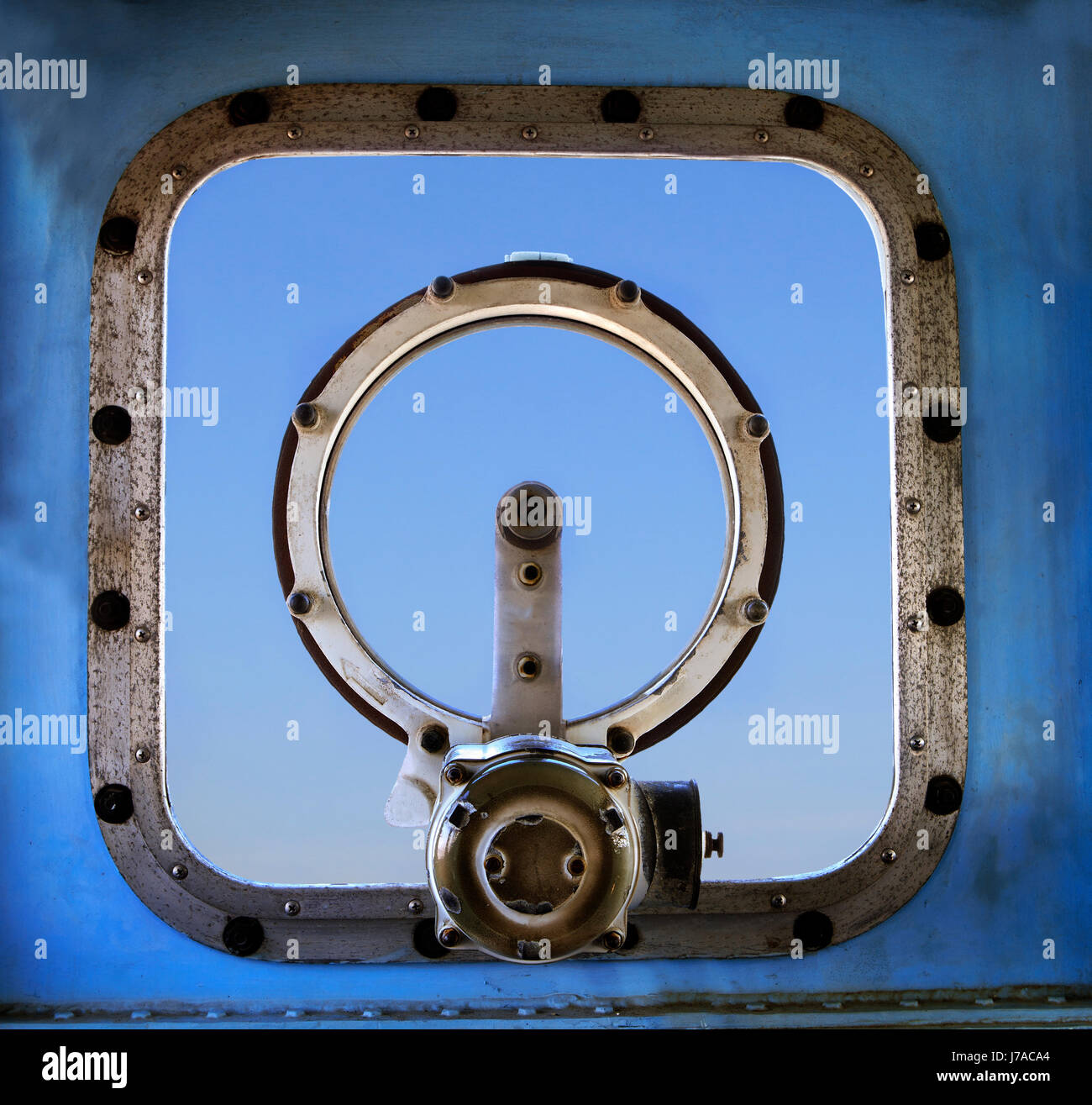 old military war ship window against blue sky background use for ...