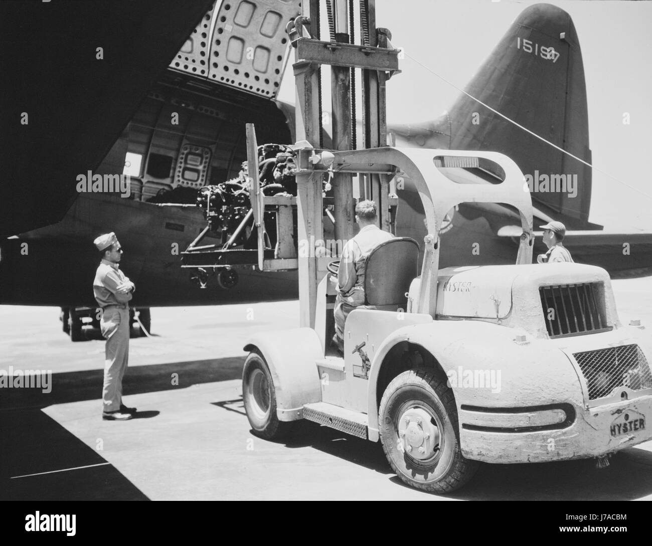 A plane of the United States Army Air Transport Command being loaded ...