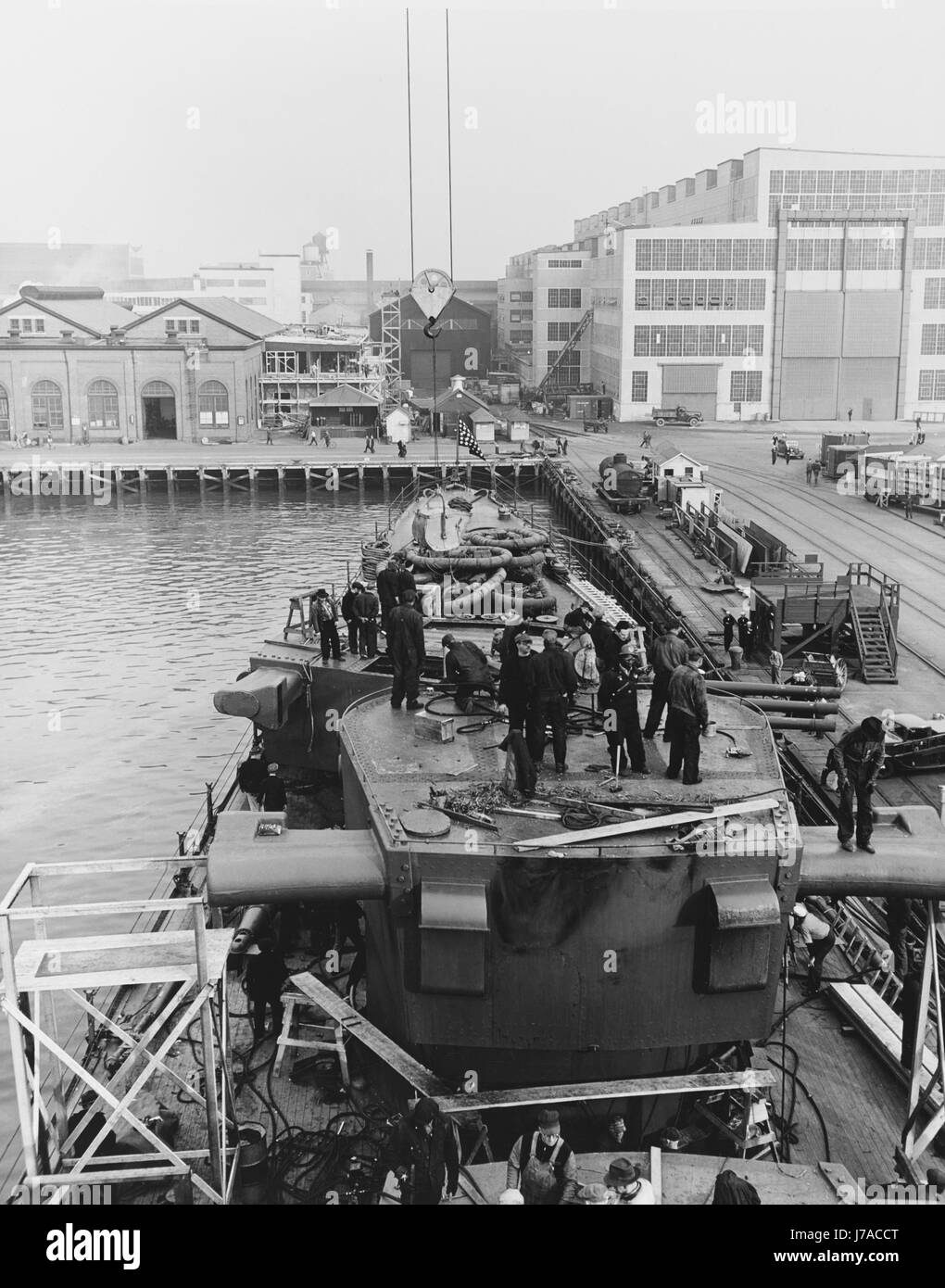 Philadelphia Navy Yard workmen repair damage on USS Boise, 1942 Stock ...