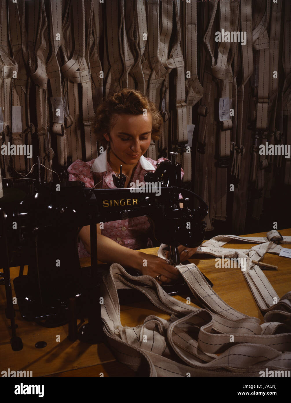 Woman stitching parachute harnesses during World War II, 1942 Stock ...