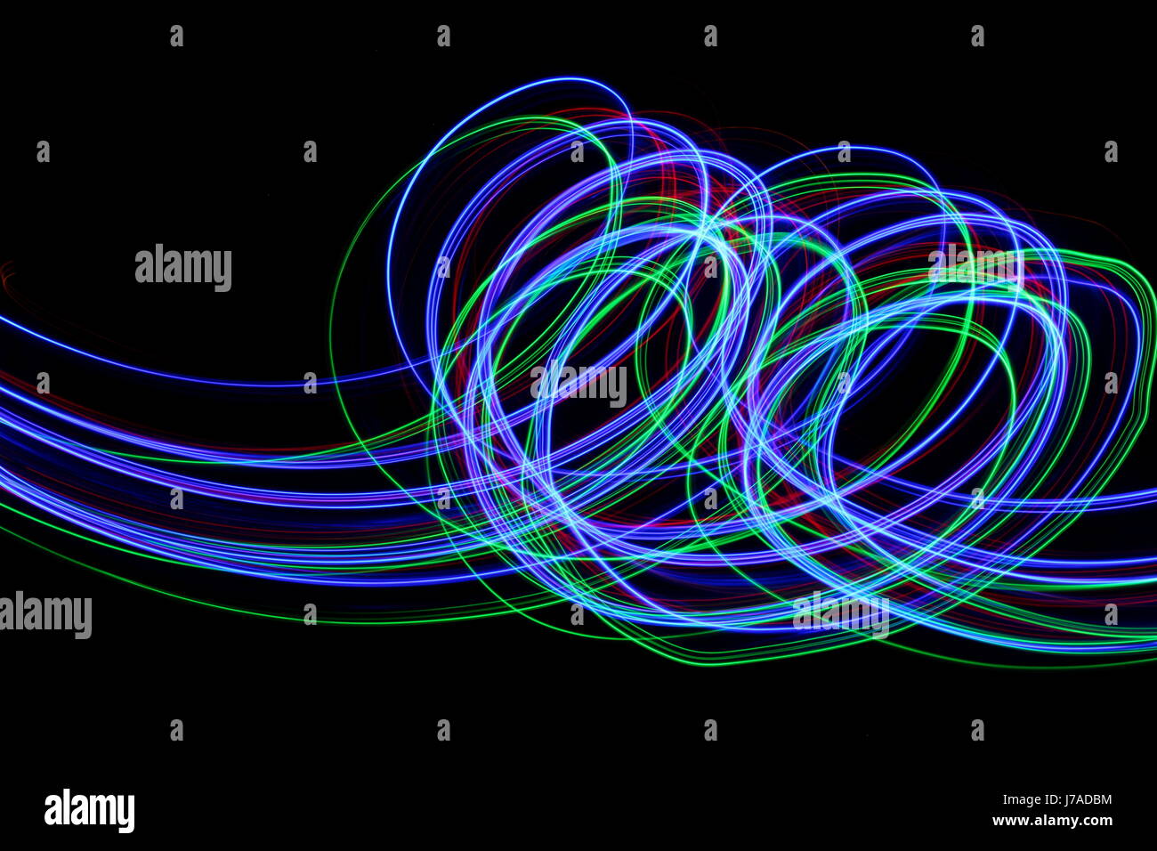Multi colour Light Painting Photography - swirls and loops against a ...