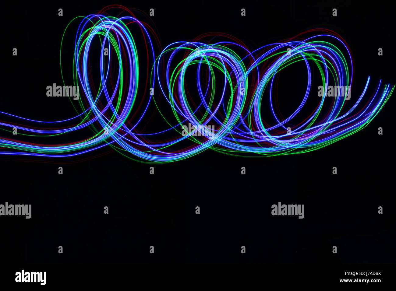 Multi colour Light Painting Photography - swirls and patterns against a ...