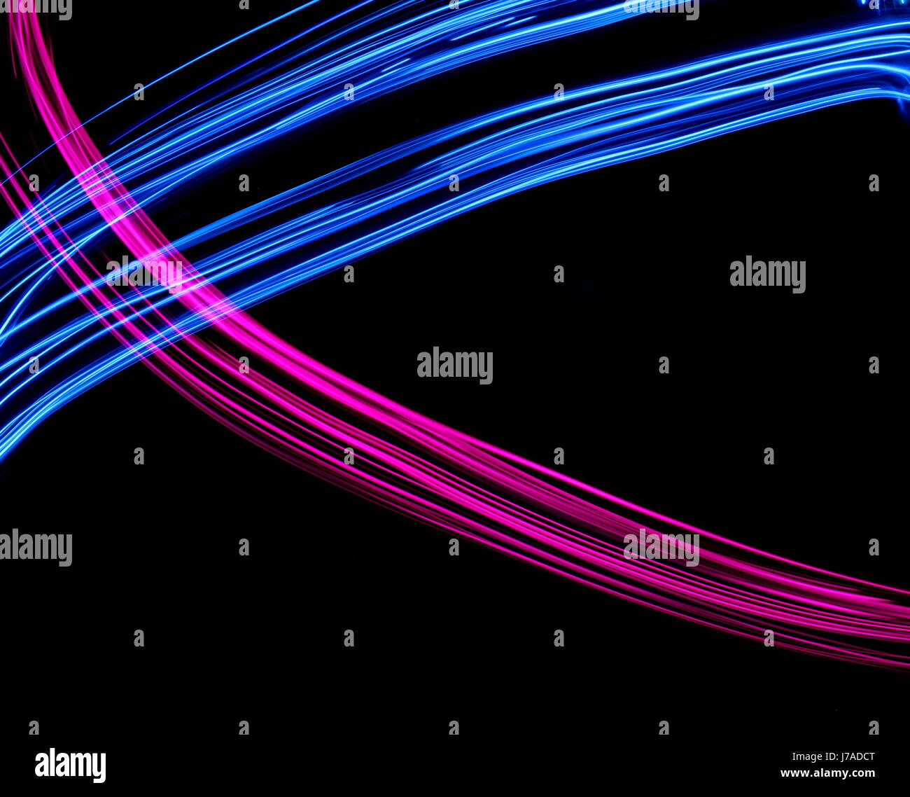 Long exposure photograph of neon pink and blue colour in an abstract ...