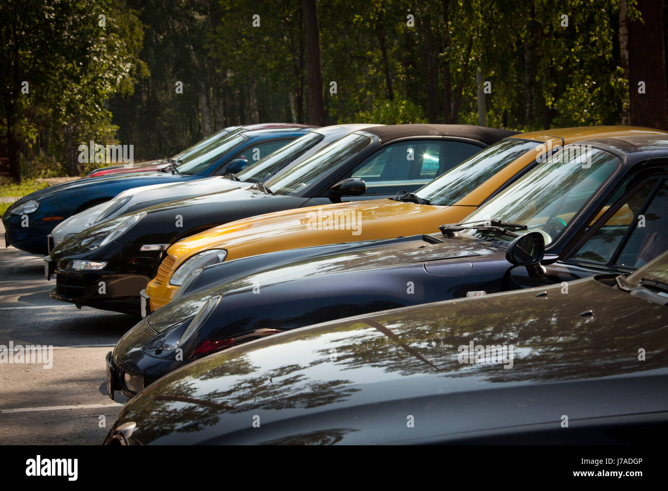 Shiny cars on parking lot Stock Photo - Alamy
