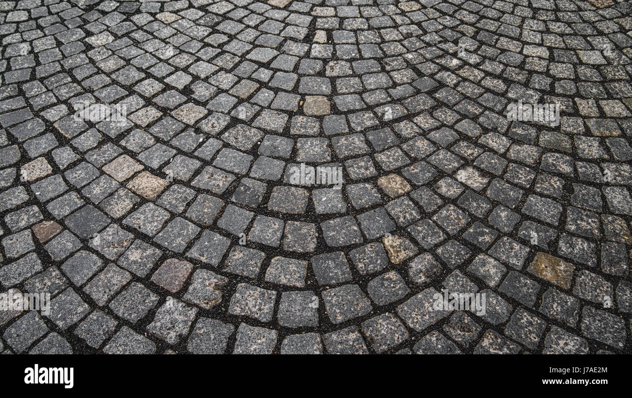Abstract background of rectangular paving stones in a semicircle. The ...