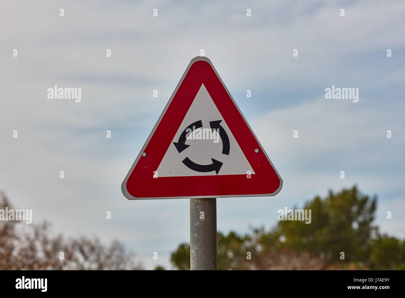 Roundabout road sign Stock Photo - Alamy