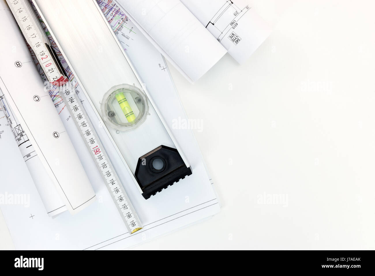 architect workplace top view. rolls of drawing paper with plans and ...