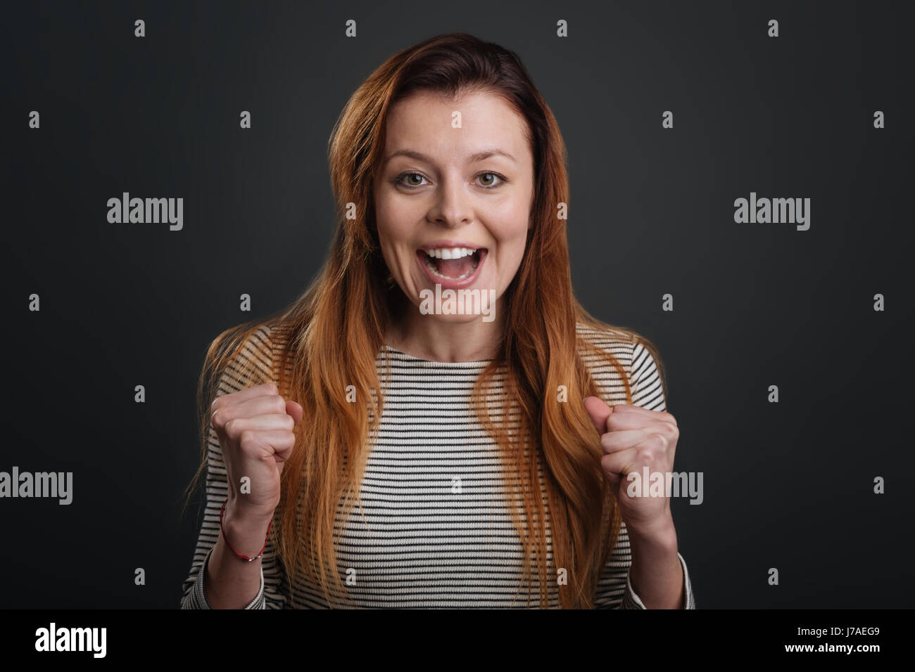 Energetic charming woman cheering for someone Stock Photo - Alamy
