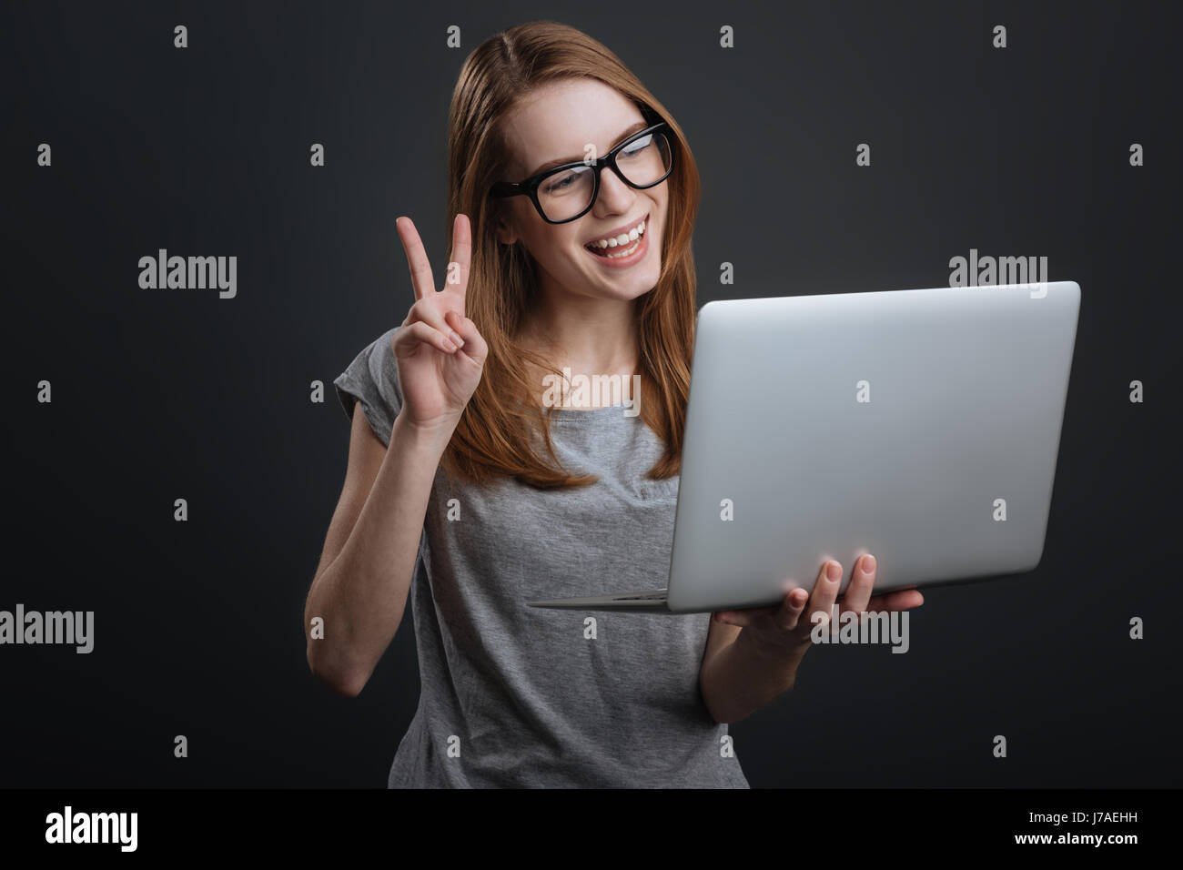 Charming intelligent lady using internet for communication Stock Photo ...