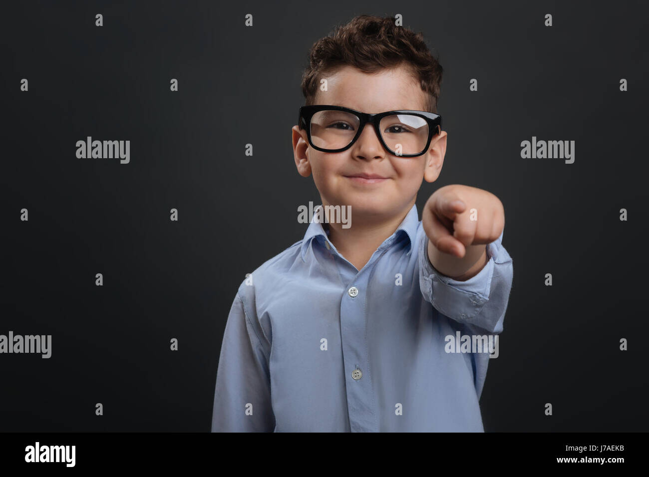 Charismatic inspiring kid pointing at you Stock Photo - Alamy