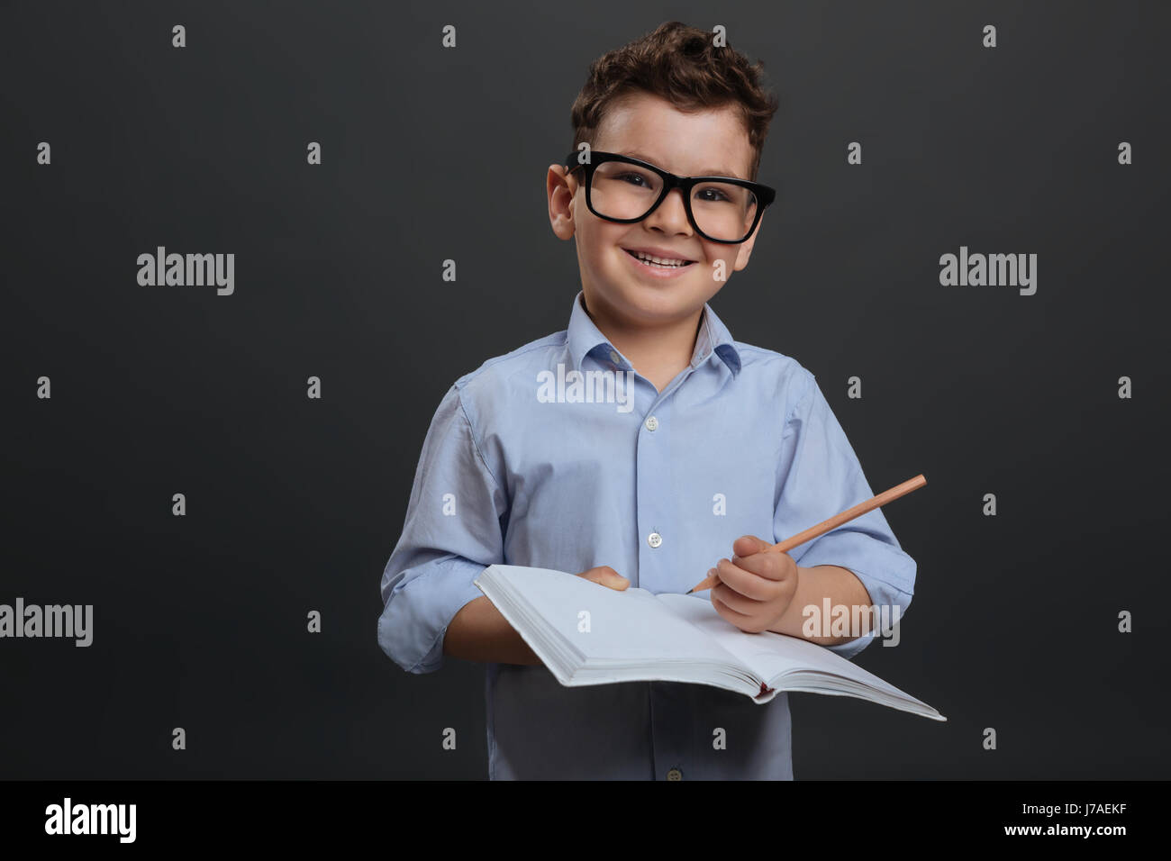 Charming young gentleman being a diligent student Stock Photo - Alamy