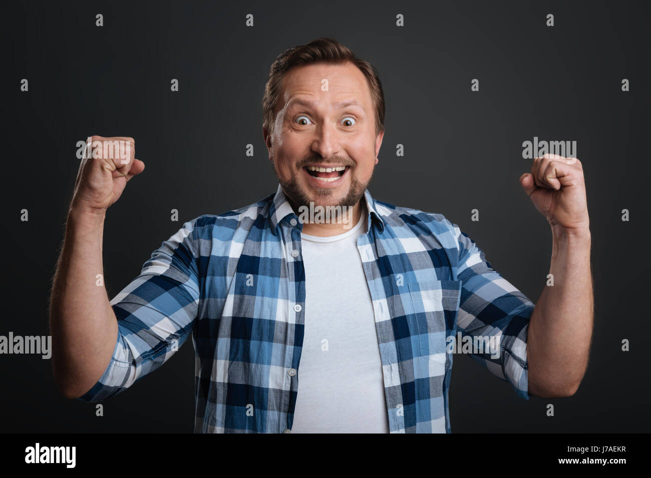 Bright emotional guy excited about something Stock Photo - Alamy