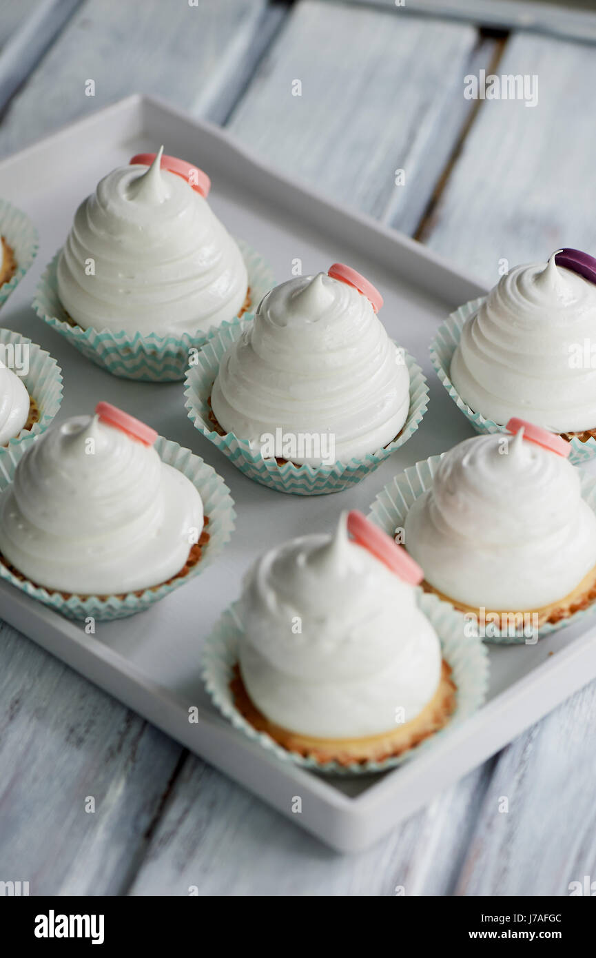Basket of cream in a paper wrapper.Culinary syringe. beautiful cream ...