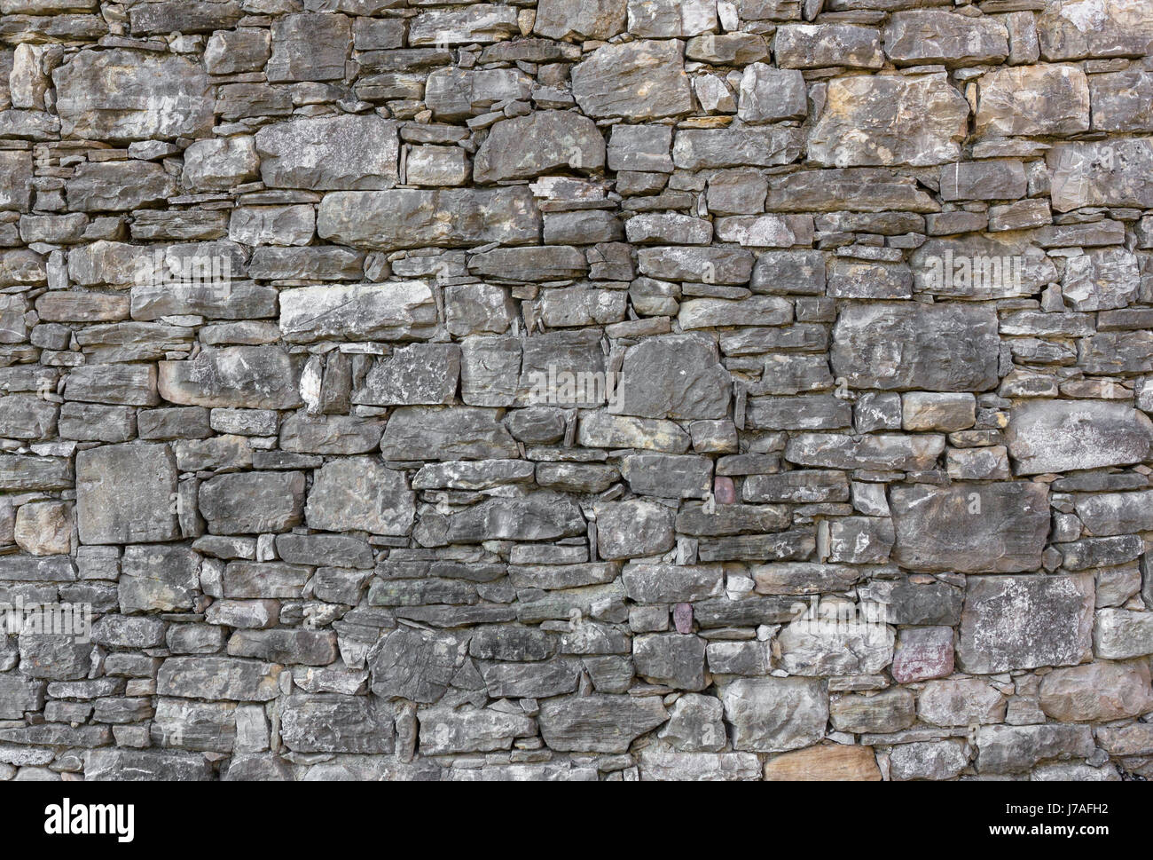 Ancient stone wall background Stock Photo - Alamy