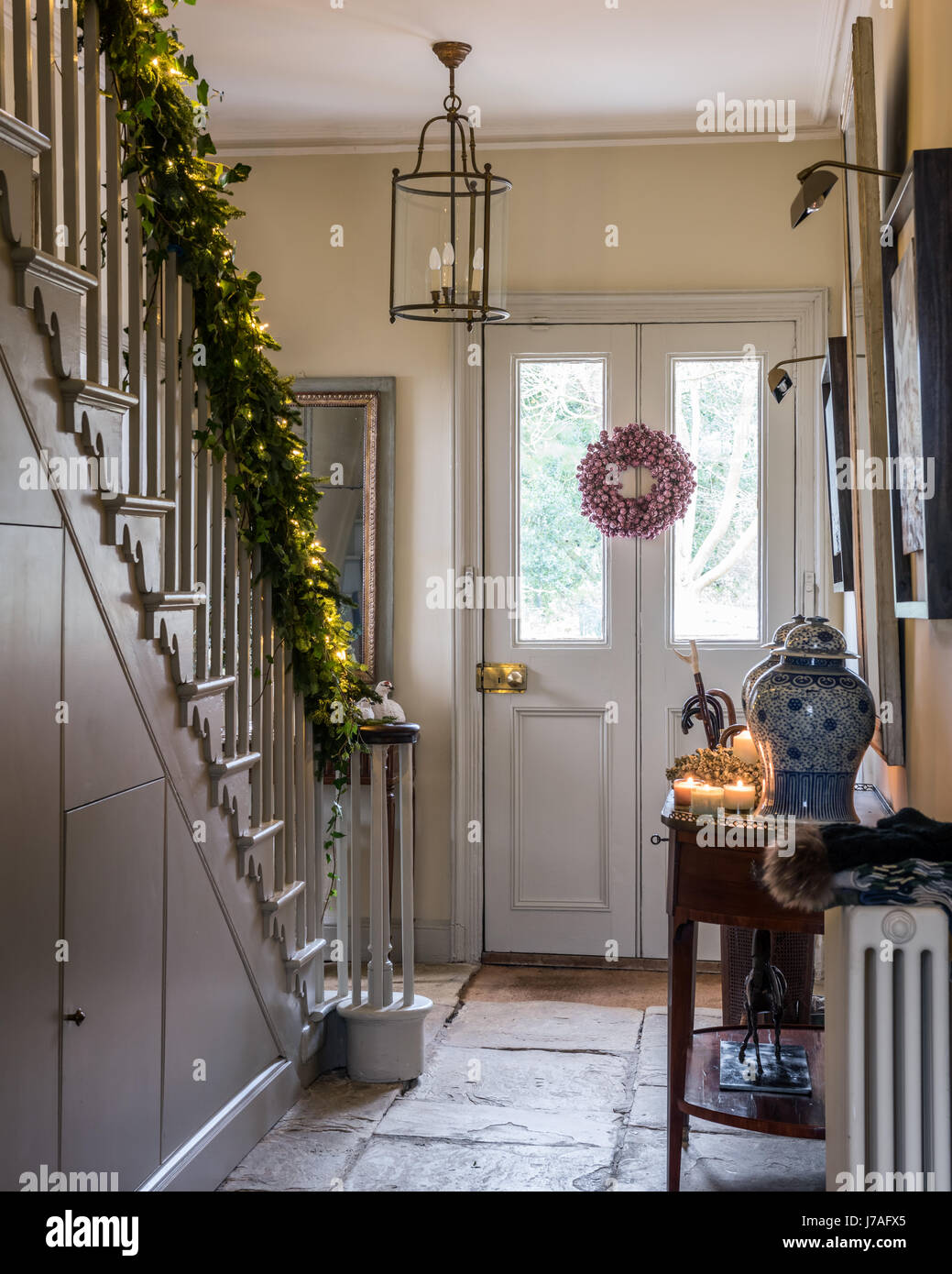 Flag stone flooring in entrance hall decorated for Christmas Stock ...