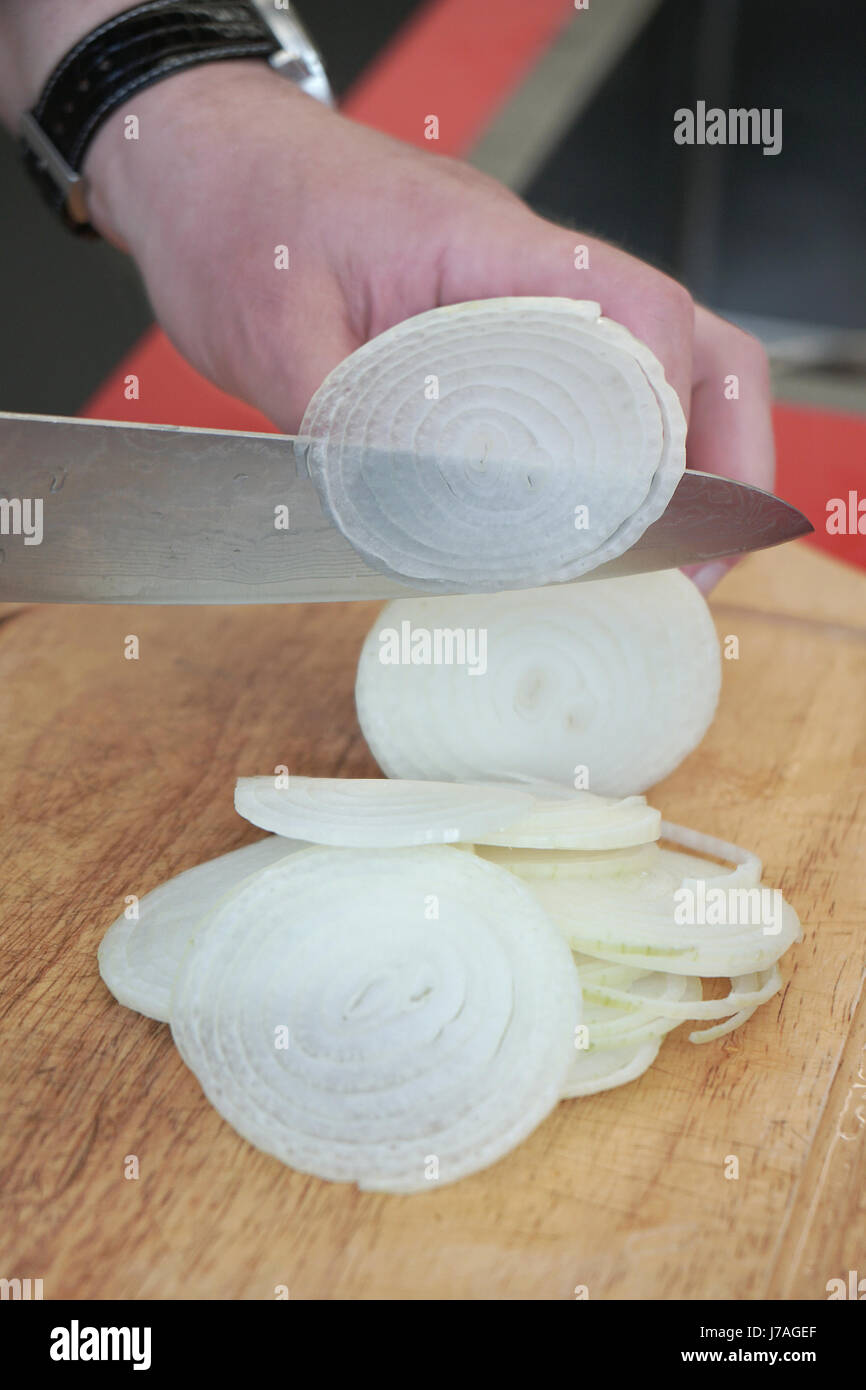Hand cutting onion hi-res stock photography and images - Alamy